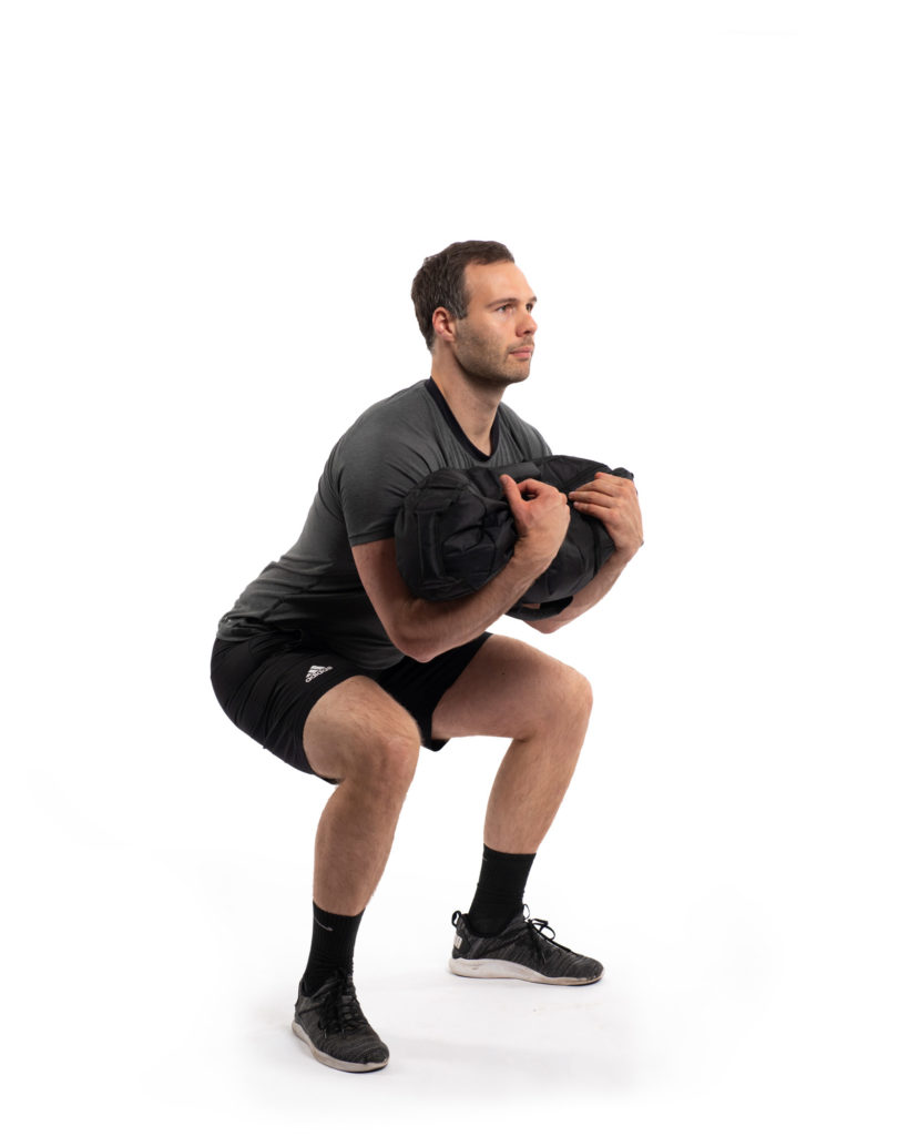 De 5 beste Sandbag oefeningen voor thuis - Fitshop Blog